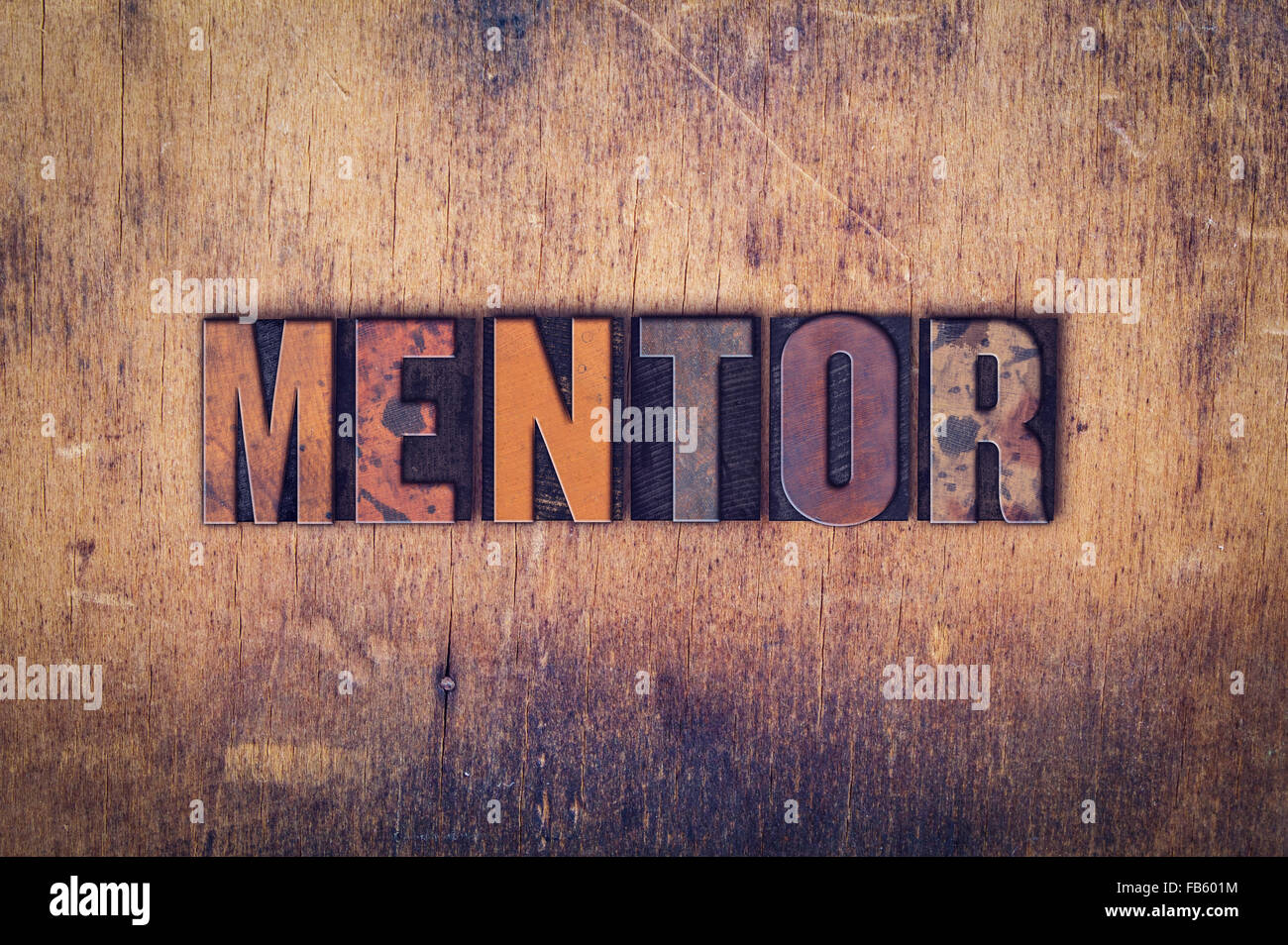 The word "Mentor" written in dirty vintage letterpress type on a aged ...