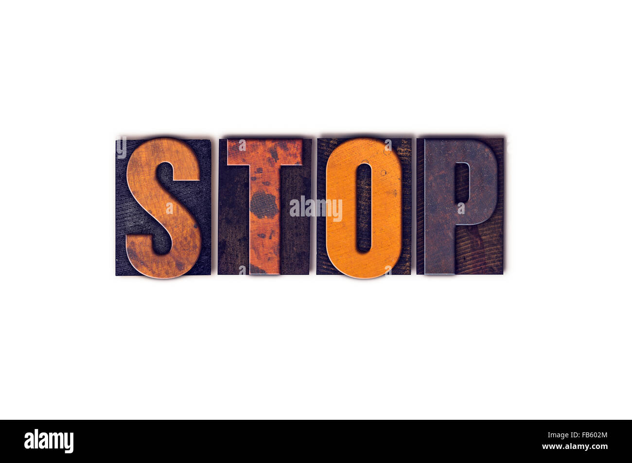 The word "Stop" written in isolated vintage wooden letterpress type on ...