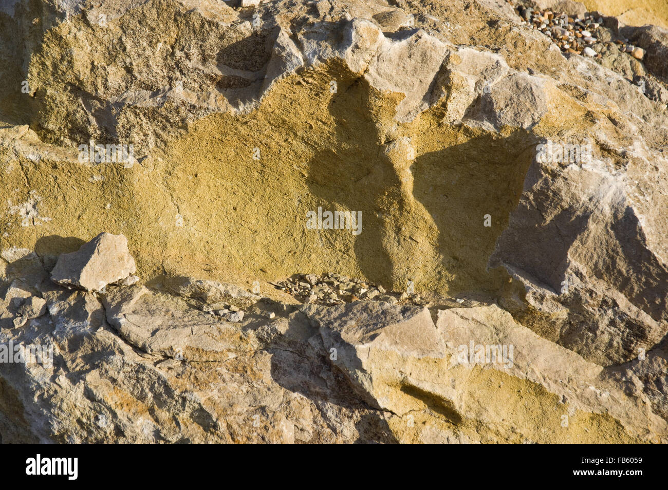 Rough rock surface lit by evening sunlight Stock Photo - Alamy