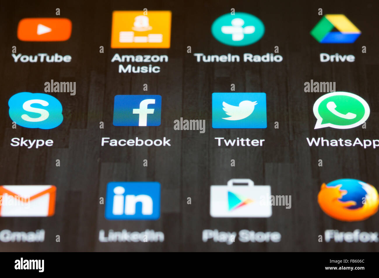 A closeup of a mobile phone screen showing some common apps Stock Photo ...