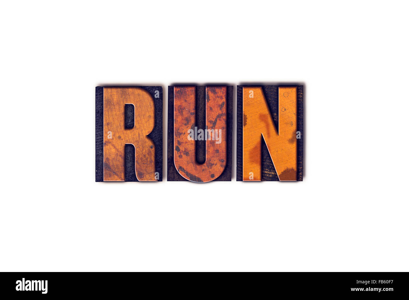 The word "Run" written in isolated vintage wooden letterpress type on a ...