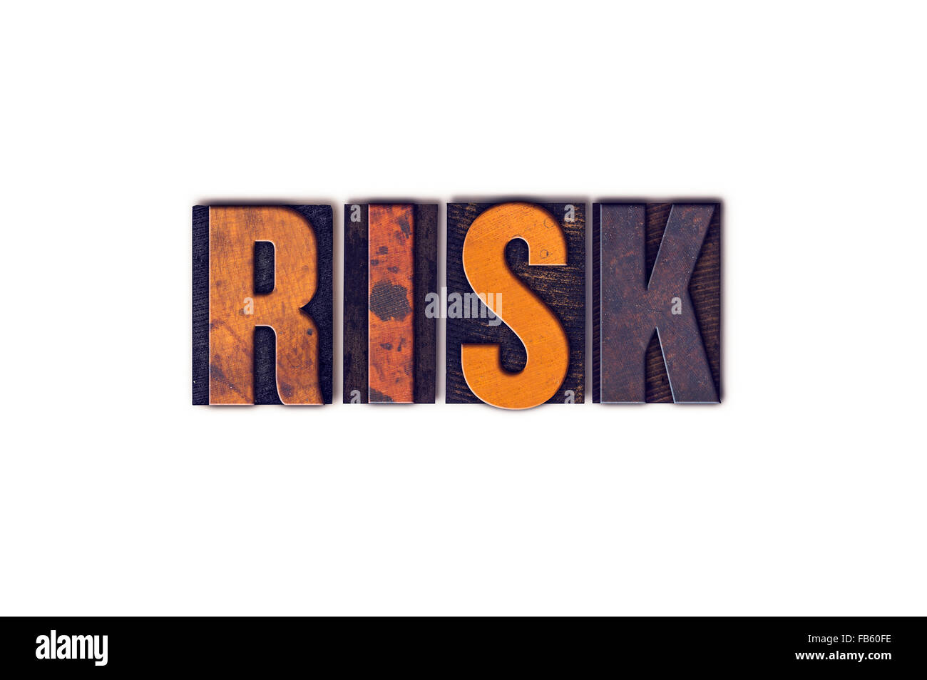 The word "Risk" written in isolated vintage wooden letterpress type on ...