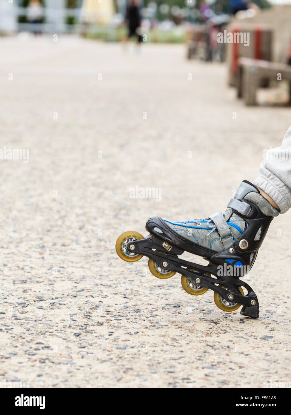 Closeup of woman girl with roller skates blades outdoor Stock Photo - Alamy