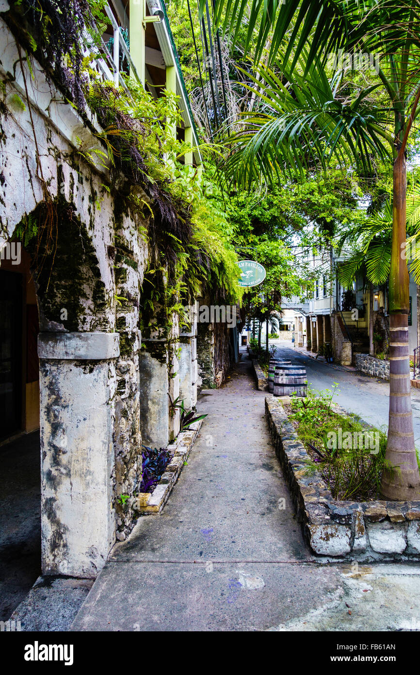 An interesting old stone arcade fronts a tiled stone alleyway in ...