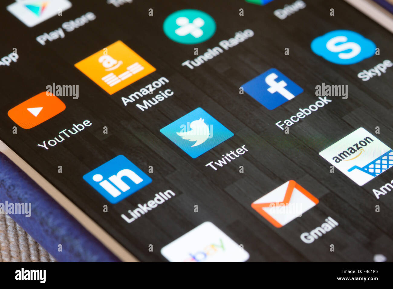 A closeup of a mobile phone screen showing common apps Stock Photo - Alamy