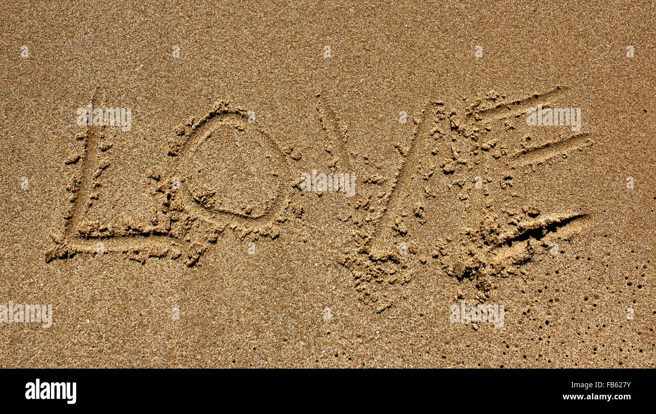 love message written in sand at beach Stock Photo - Alamy