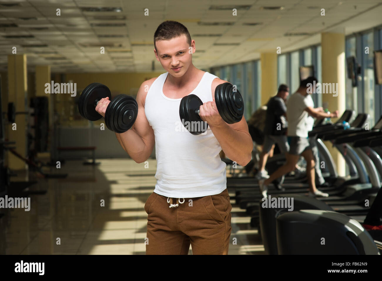Guy in gym Stock Photo - Alamy