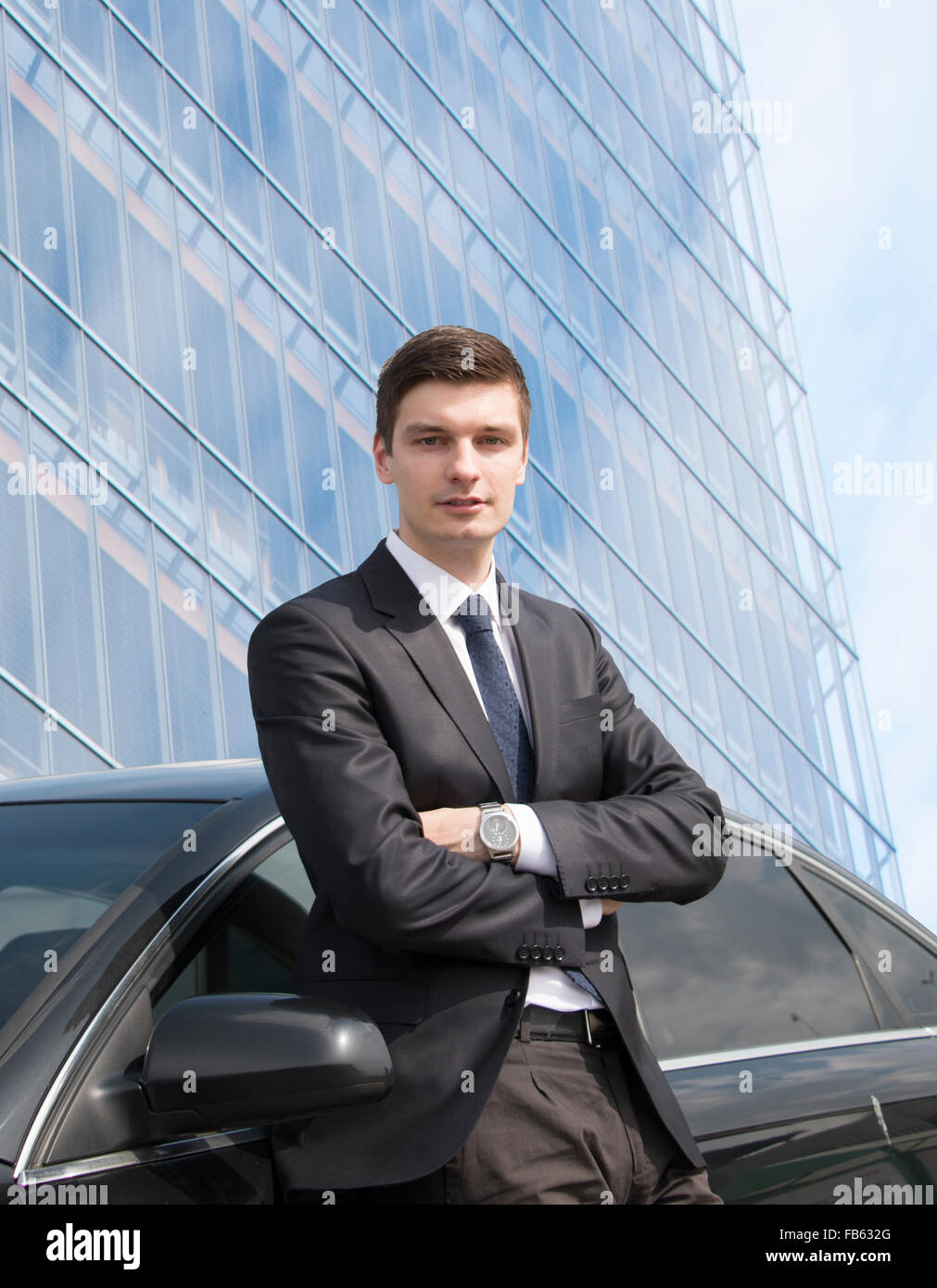 Young businessman standing near his car Stock Photo - Alamy Young businessman standing near his car Stock Photo - Alamy