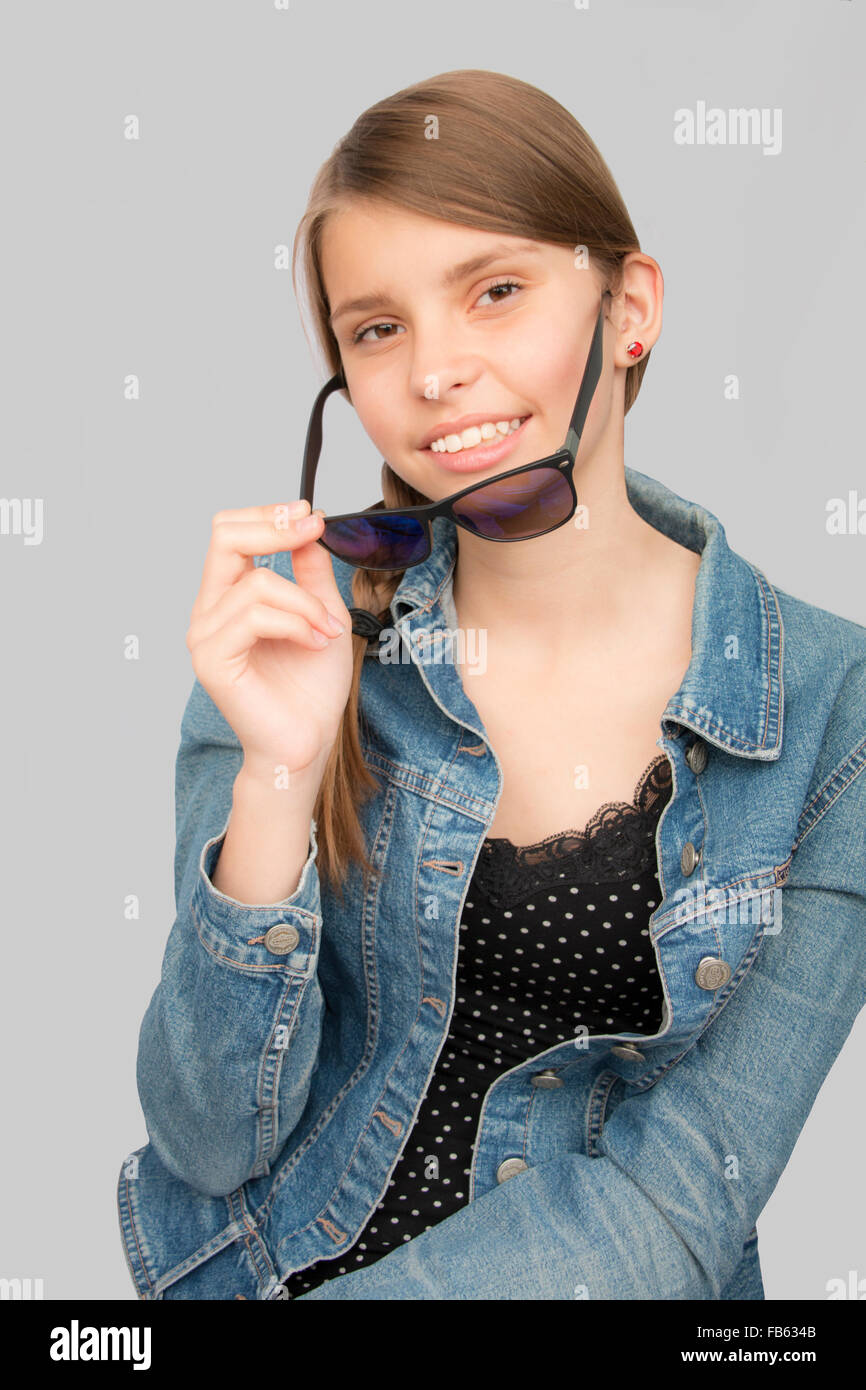 Portrait teenage girl with sunglasses Stock Photo - Alamy