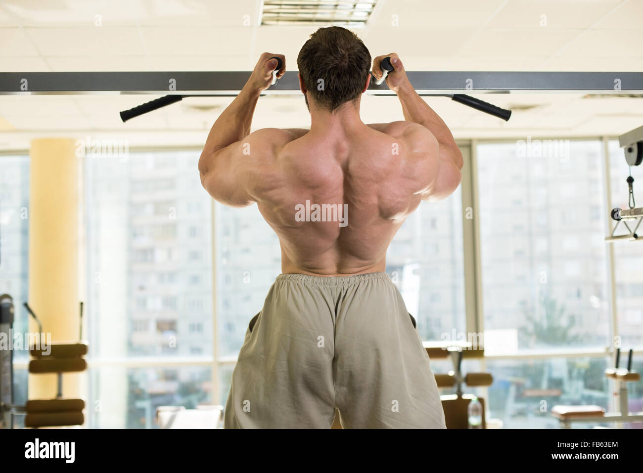 Champion doing pull-ups Stock Photo - Alamy