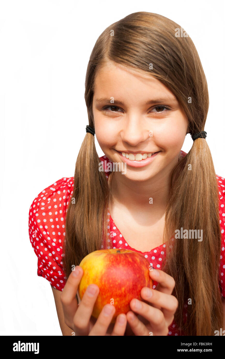 Teenage girl with apple Stock Photo - Alamy