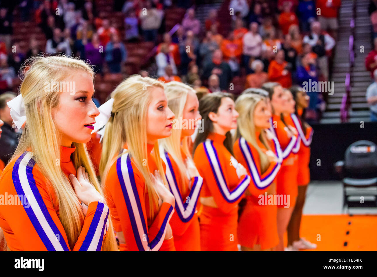 Clemson cheerleaders for the National Anthem during the NCAA basketball ...