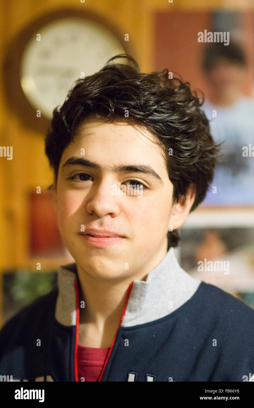 close portrait of Caucasian boy with reassuring look in warm and bright ...