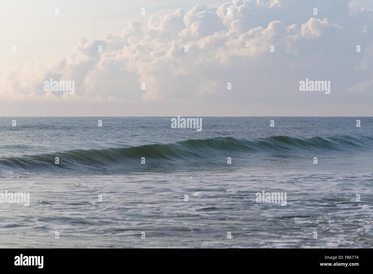 A landscape of a calming wave gently approaching of Atlantic ocean ...