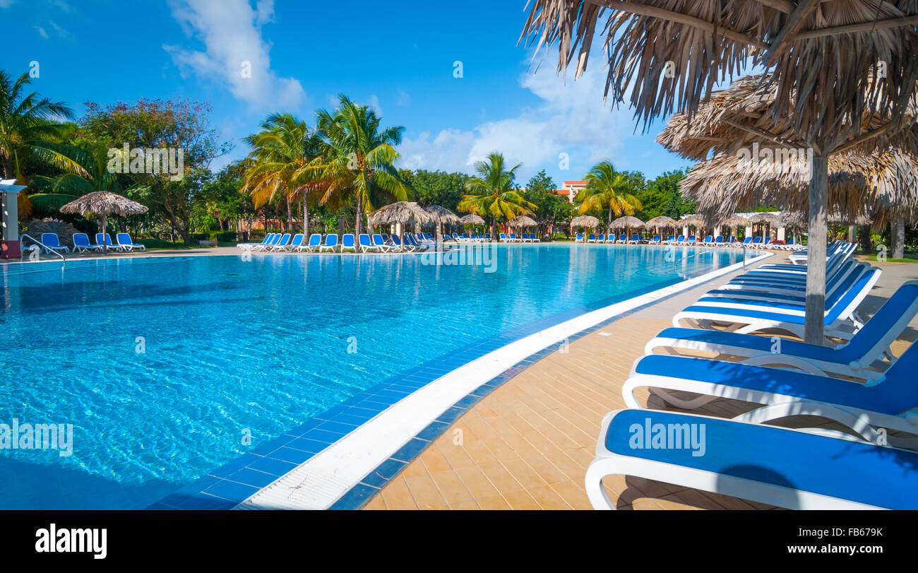Beautiful blue sky holiday resort pool side view. Getaway vacation in ...