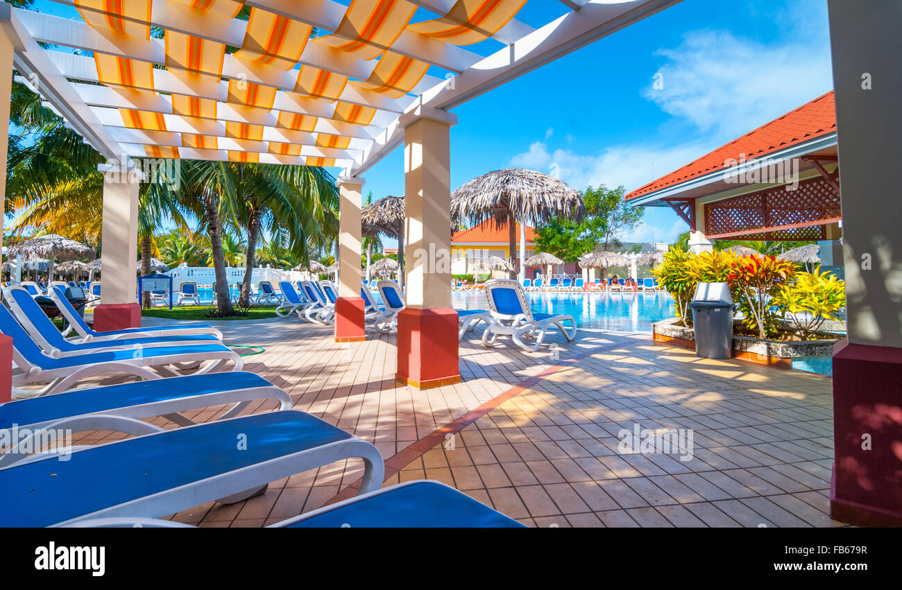 Beautiful blue sky holiday resort pool side view. Getaway vacation in ...