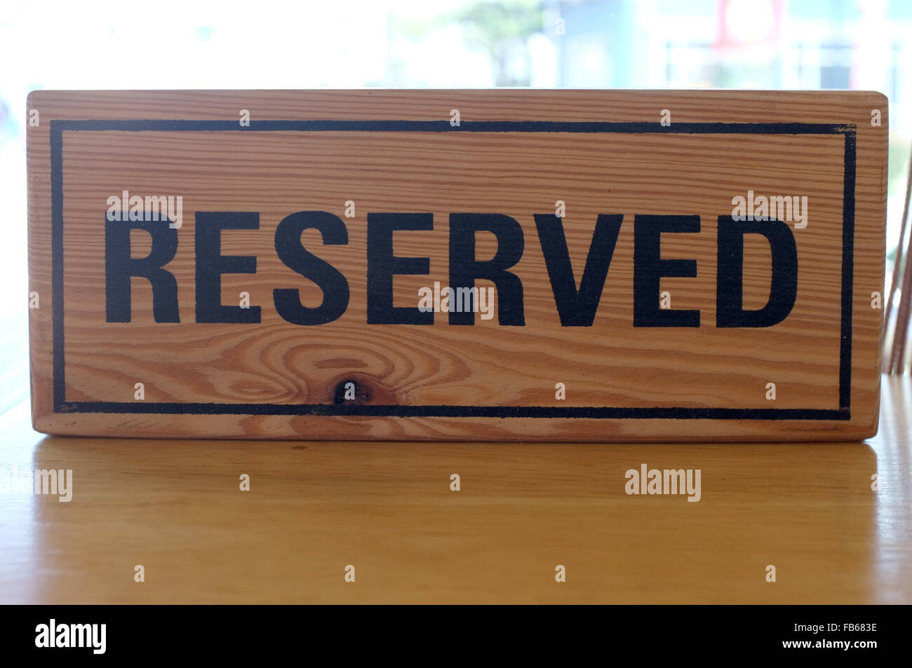 Reserved wooden sign on table Stock Photo - Alamy