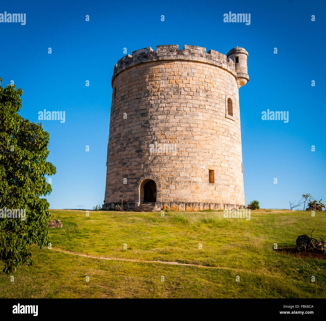 Round shaped, small, stone built, castle on plot of countryside land in ...