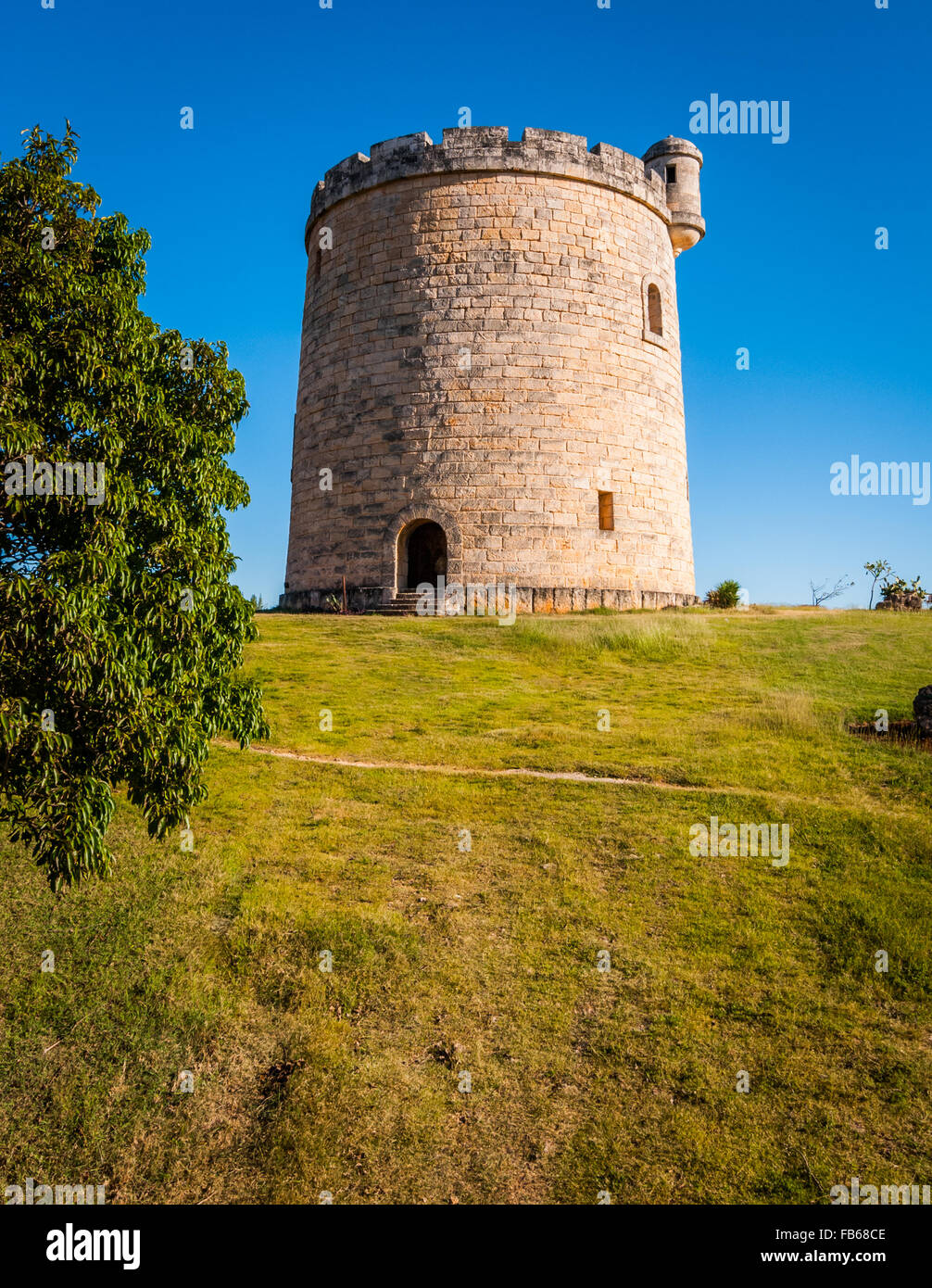 Round shaped, small, stone built, castle on plot of countryside land in ...