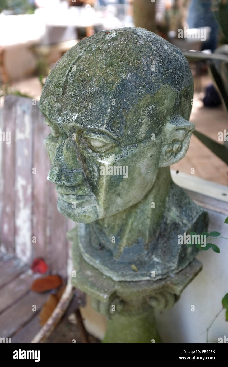 Sculpture covered with moss in garden Stock Photo - Alamy