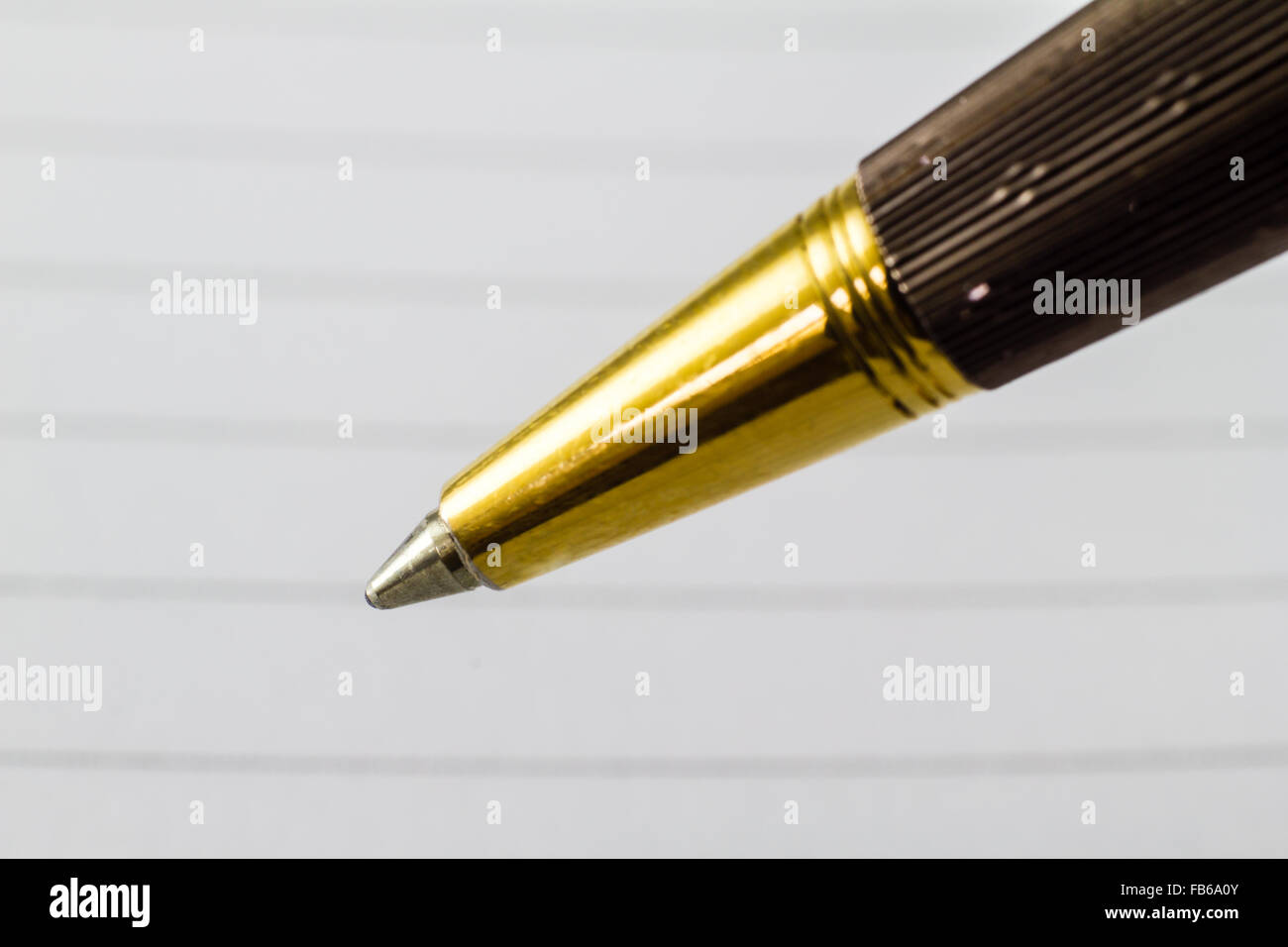 White notebook gold pen hi-res stock photography and images - Alamy