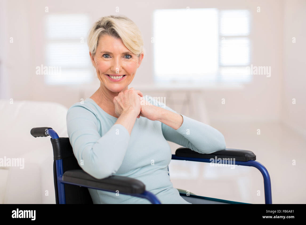 pretty handicapped middle aged woman sitting in wheelchair Stock Photo ...