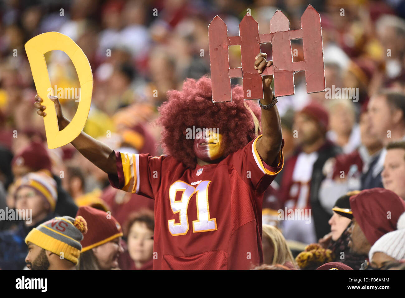 Landover, MD, USA. 10th Jan, 2016. A redskins fan holds up a defense ...