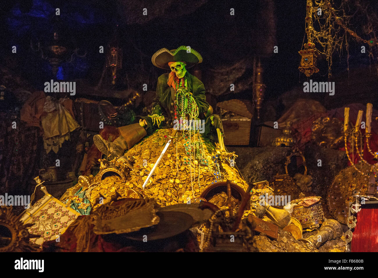 A pirate character sits on gold, Pirates of the Caribbean ride ...