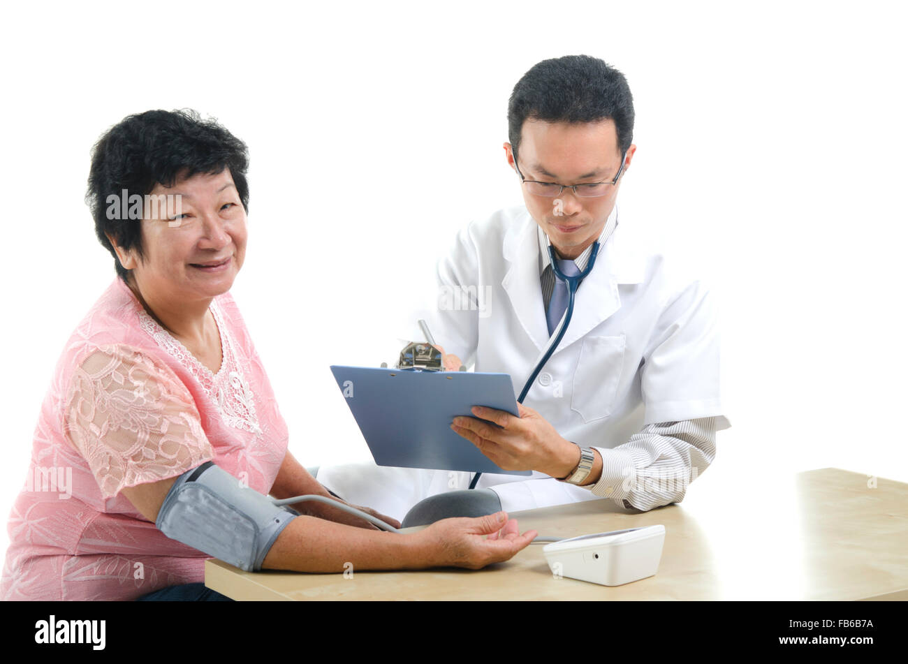 Young smiling doctor checking hi-res stock photography and images - Alamy