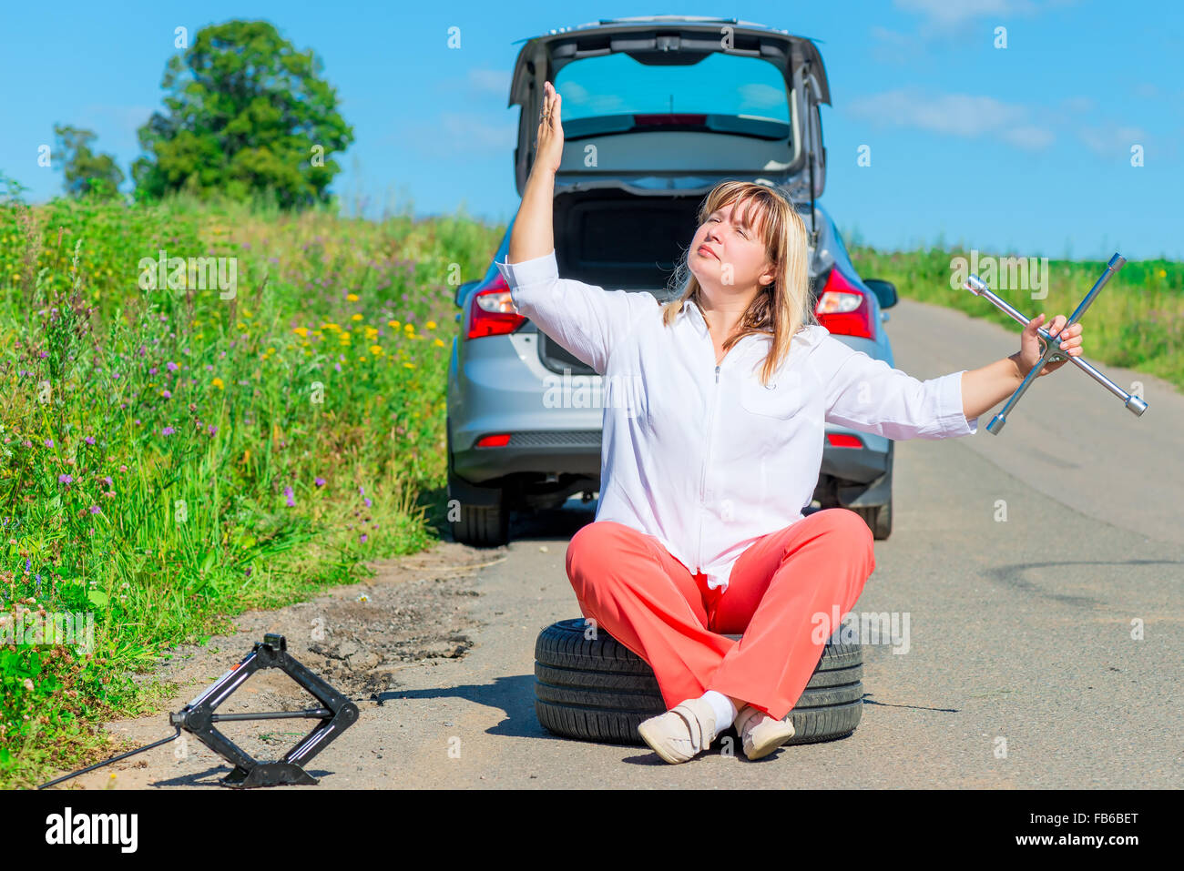 driver of 50 years and the bursting of the wheel Stock Photo - Alamy