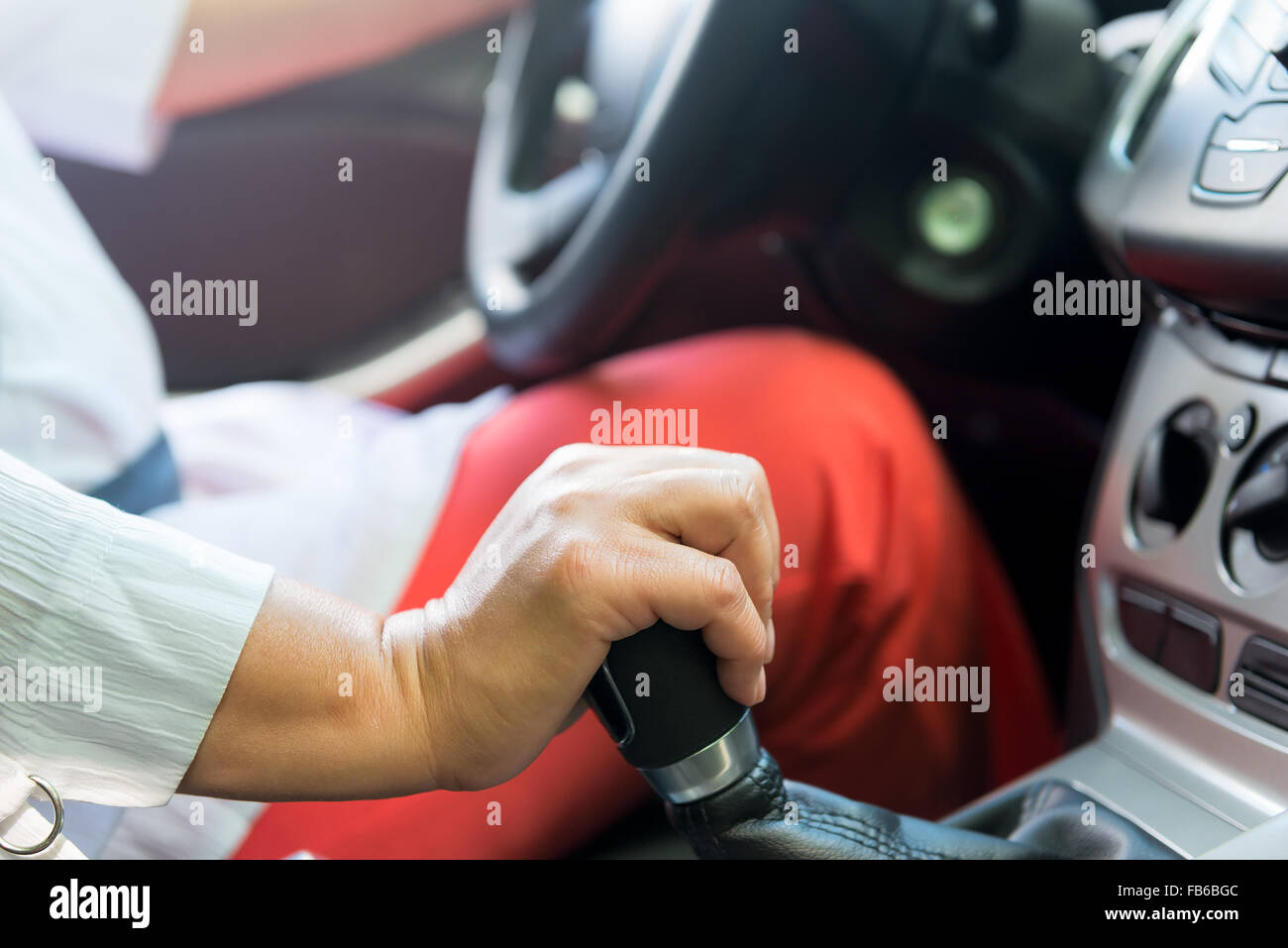 woman's hand speed switches in the vehicle while driving Stock Photo ...