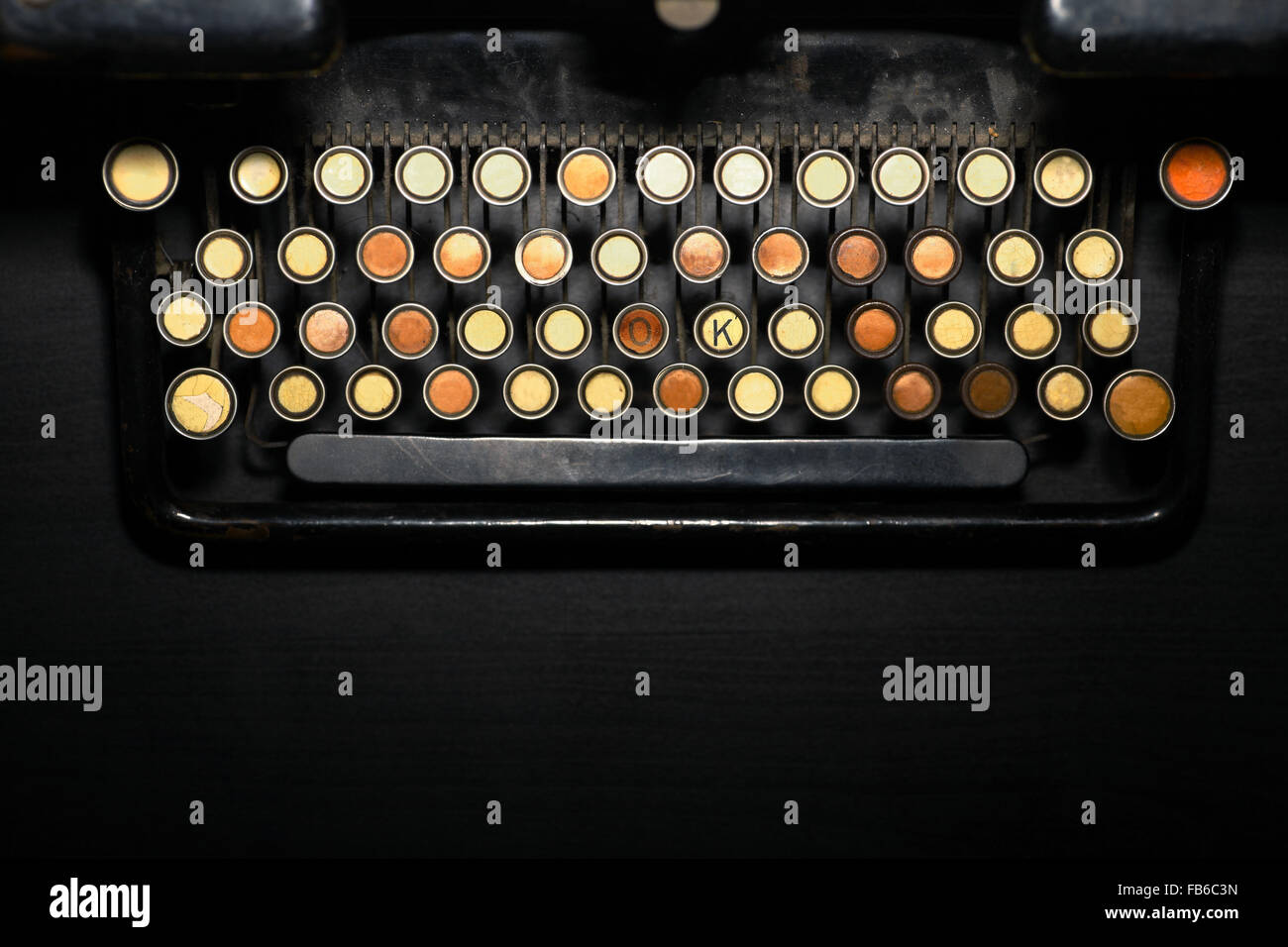 Color close up of a typewriter keyboard, having the word 'OK' written ...