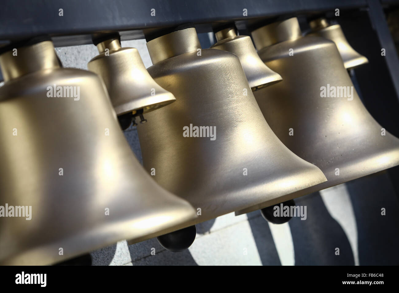 Color image of some various sized bells in a row Stock Photo - Alamy