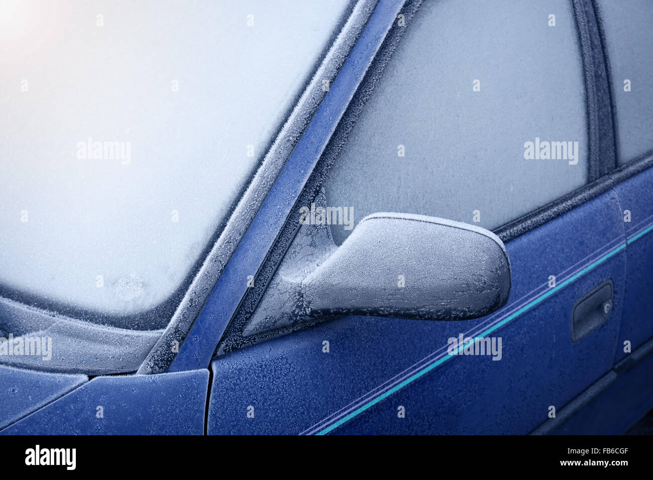 Car window and side mirror covered with ice in the morning Stock Photo ...