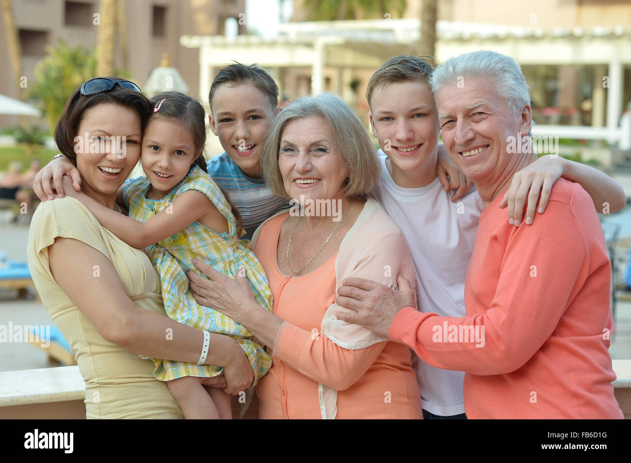 Family relaxing at resort Stock Photo - Alamy