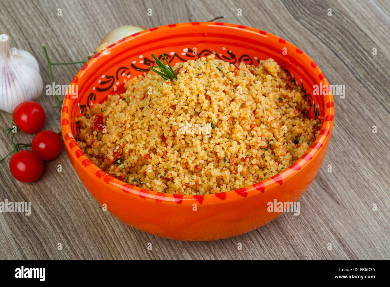 Arabic traditional cuisine - Couscous with tomato and green onion Stock ...
