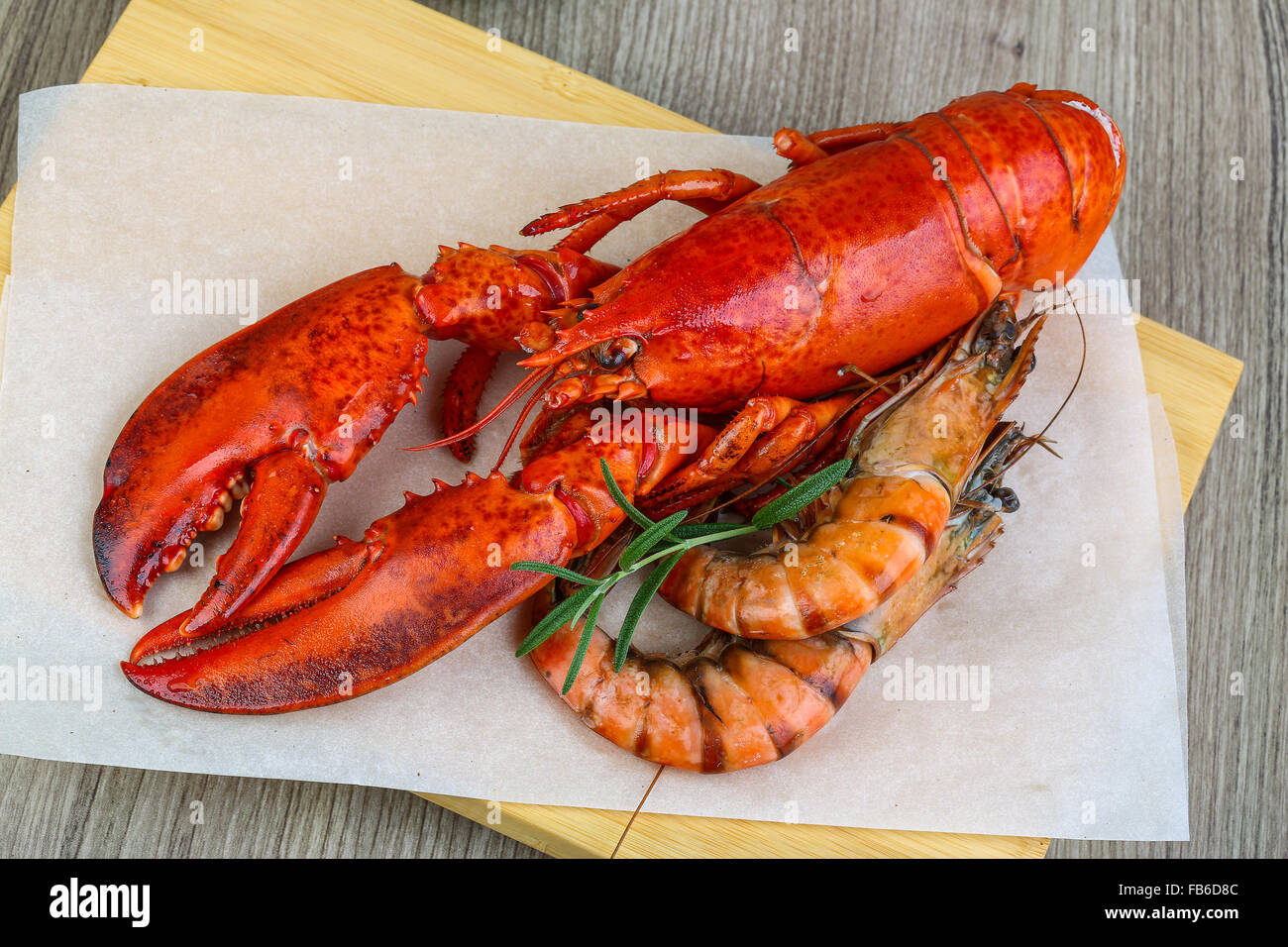 Big cooked lobster and tiger shrimps ready for eating Stock Photo - Alamy