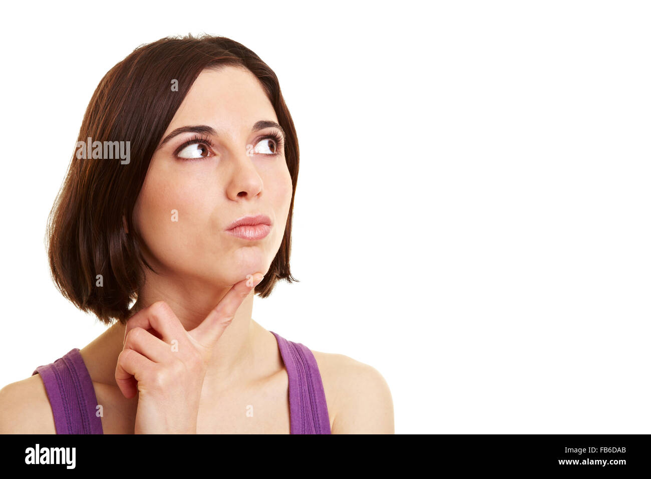Young pensive woman looking up thoughtfully Stock Photo - Alamy