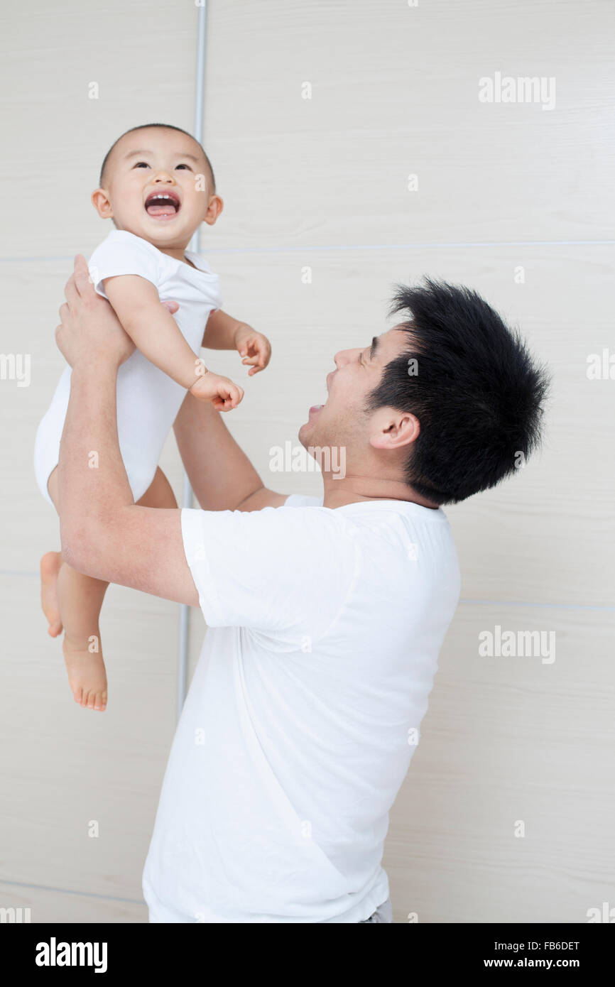 Tender moment between Chinese father and son, real people Stock Photo ...