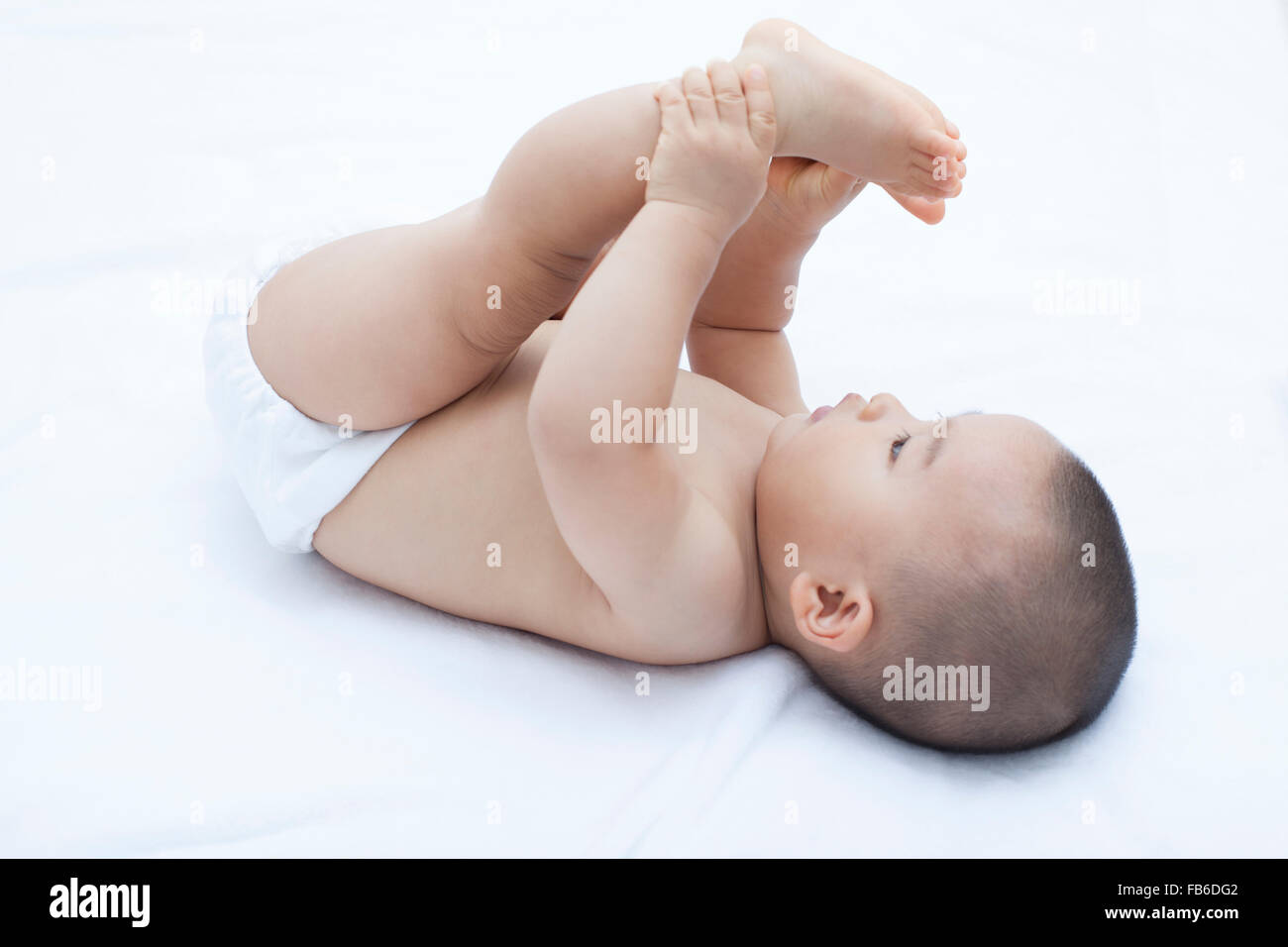 Cute Chinese baby boy playing in bed, shot in Beijing, China Stock ...