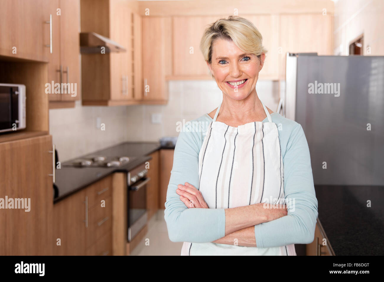 Beautiful woman in apron hi-res stock photography and images - Alamy