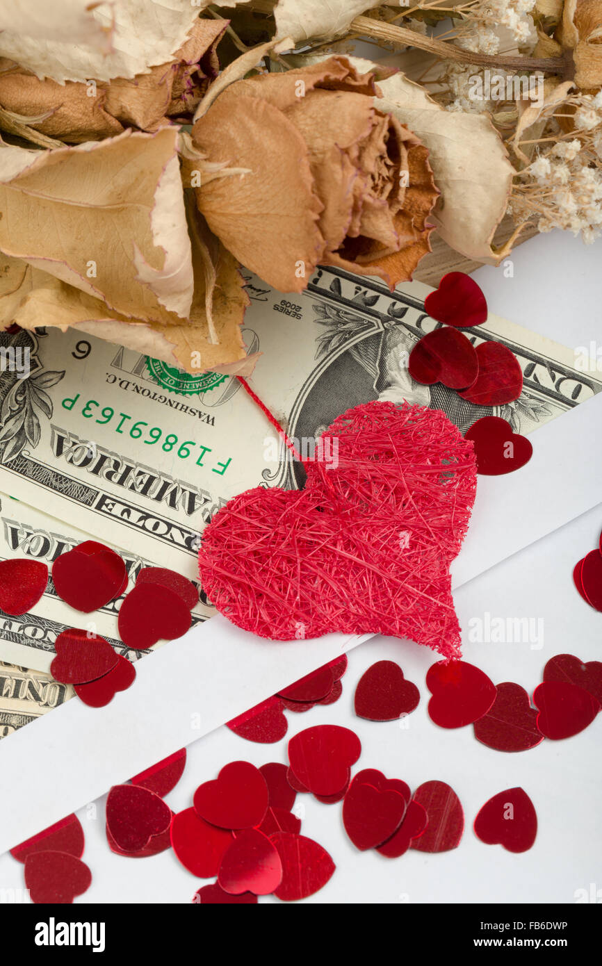 valentine concept with hearts, dry roses and us dollar banknotes as ...
