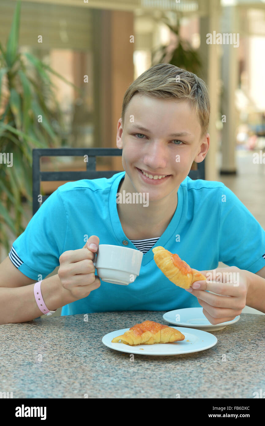 Happy boy at breakfast Stock Photo - Alamy
