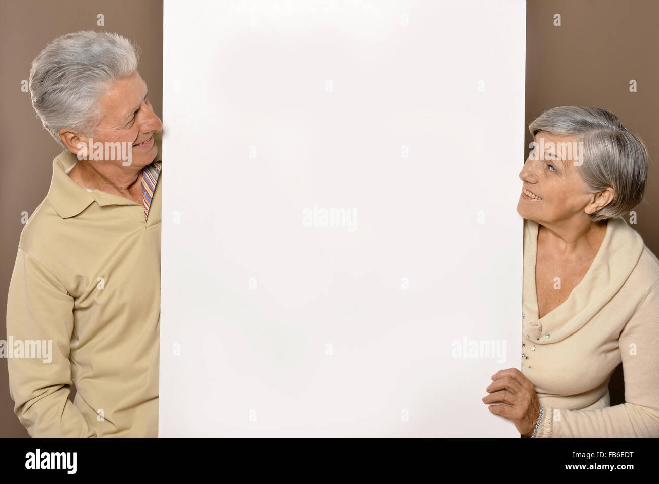 Old age couple holding Stock Photo - Alamy