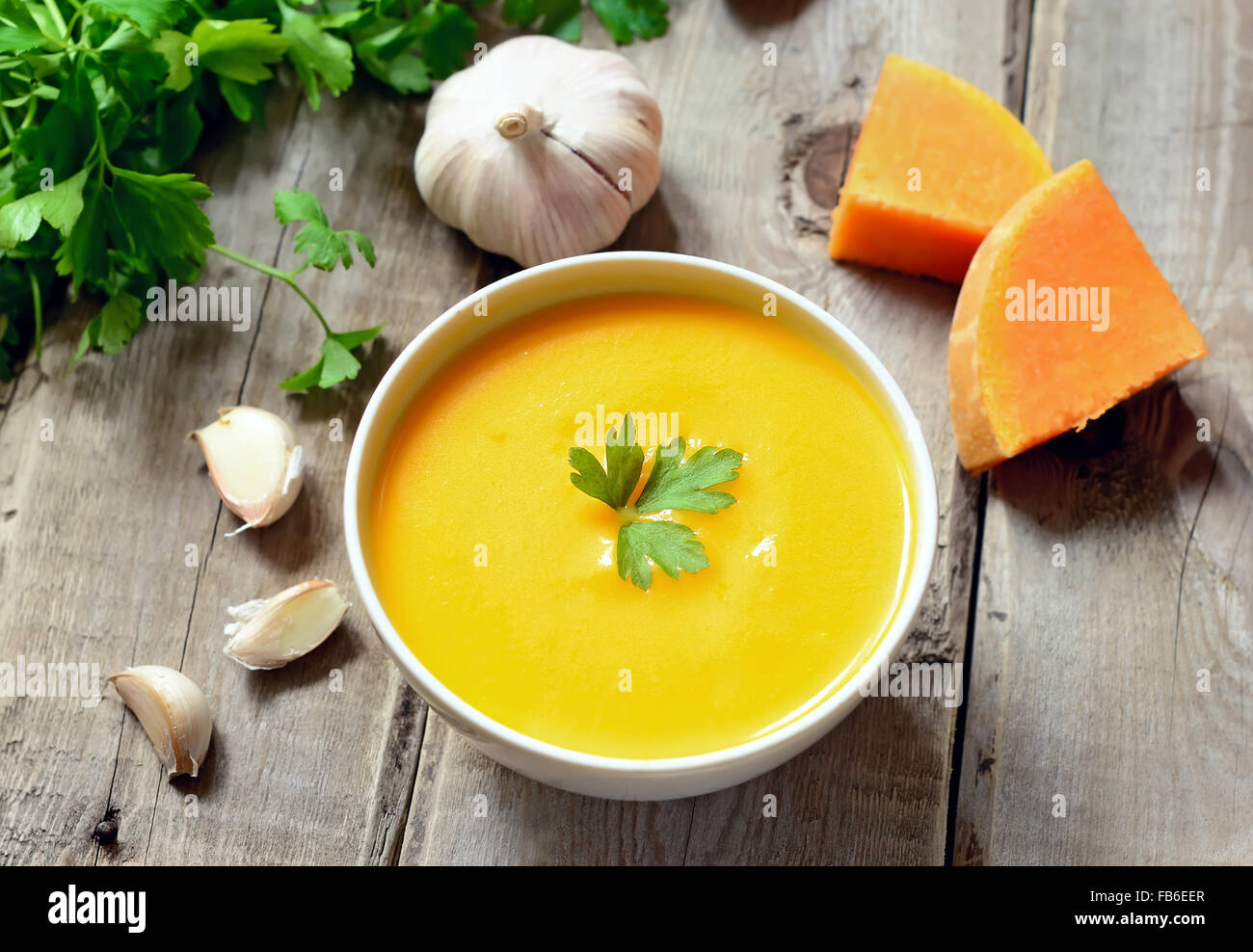 Pumpkin soup on wooden table, top view Stock Photo - Alamy