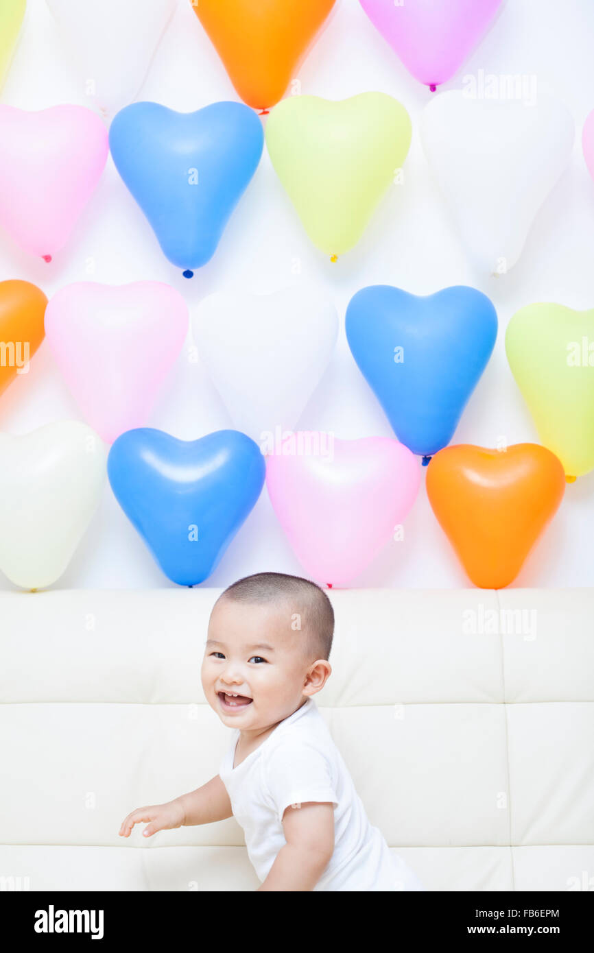 Chinese baby boy and colorful balloons, shot in Beijing, China Stock ...