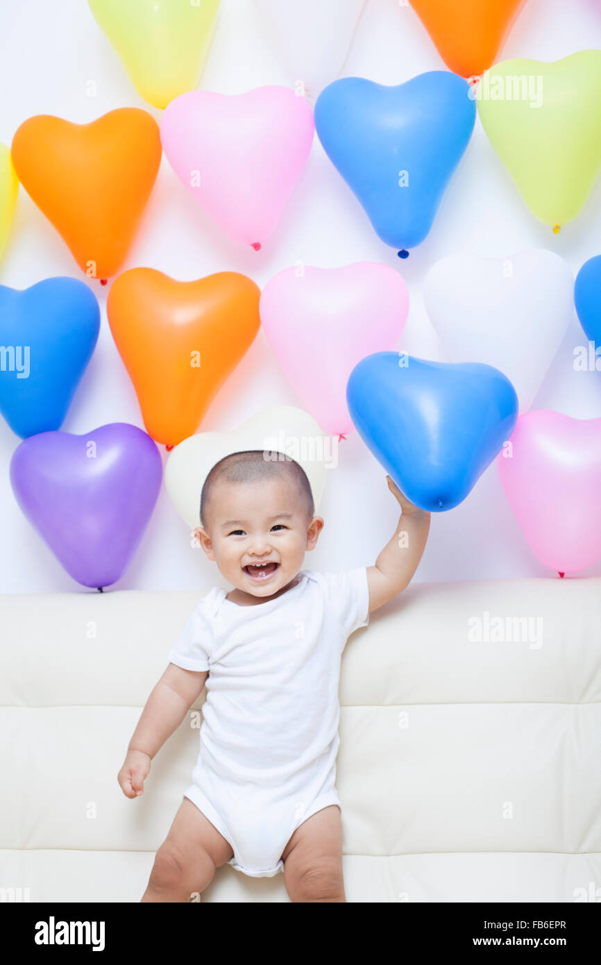 Chinese baby boy and colorful balloons, shot in Beijing, China Stock ...