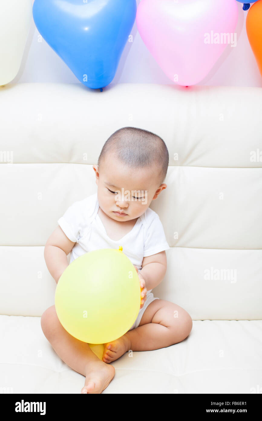 Chinese baby boy and colorful balloons, shot in Beijing, China Stock ...