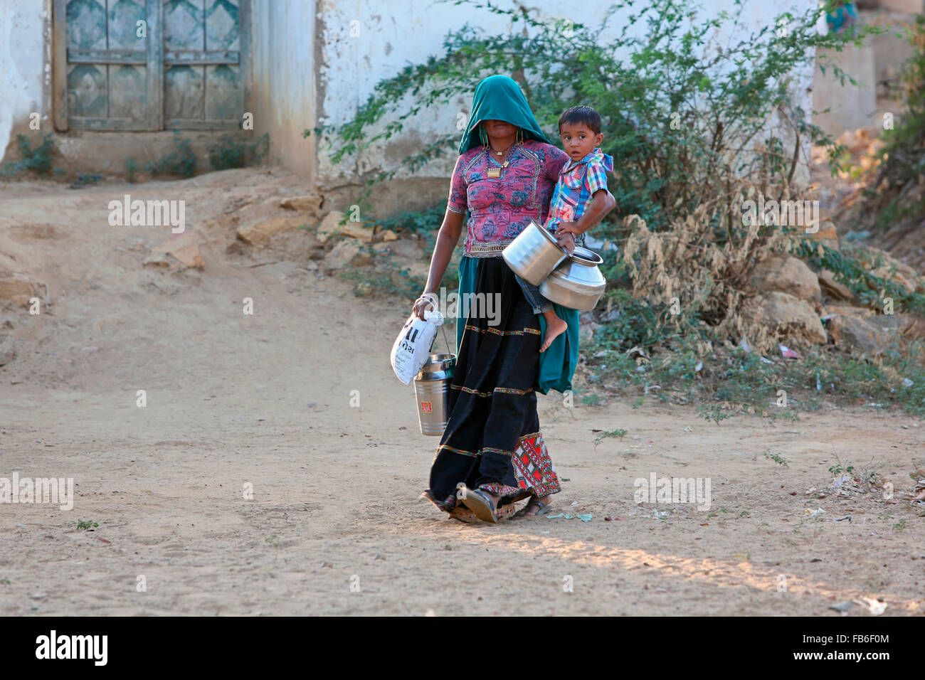 Kacchi Rabari (Desi), Laharia Village, woman carrying her son, Kutch ...
