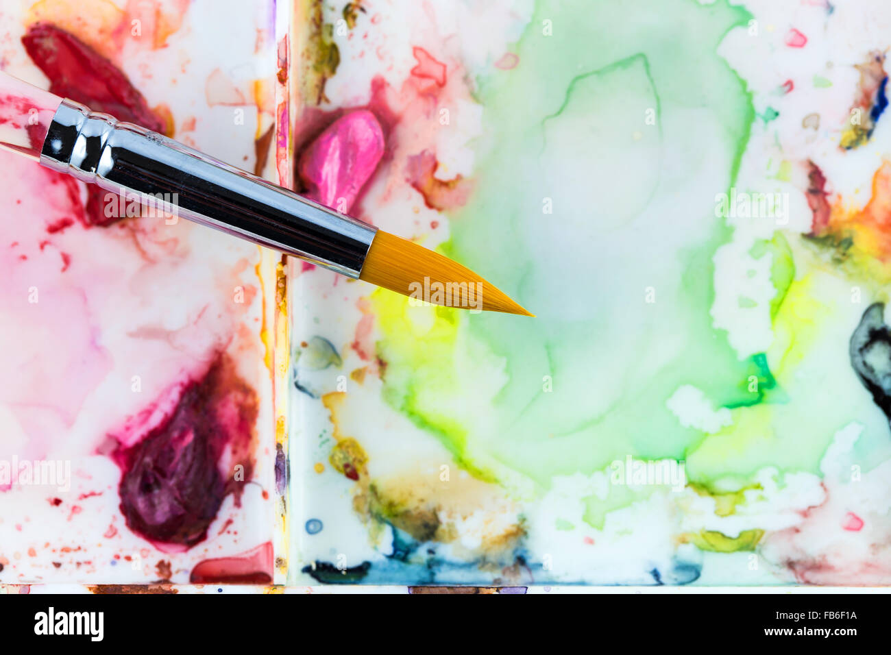Focus on water color painting brush with blur tray as background Stock ...